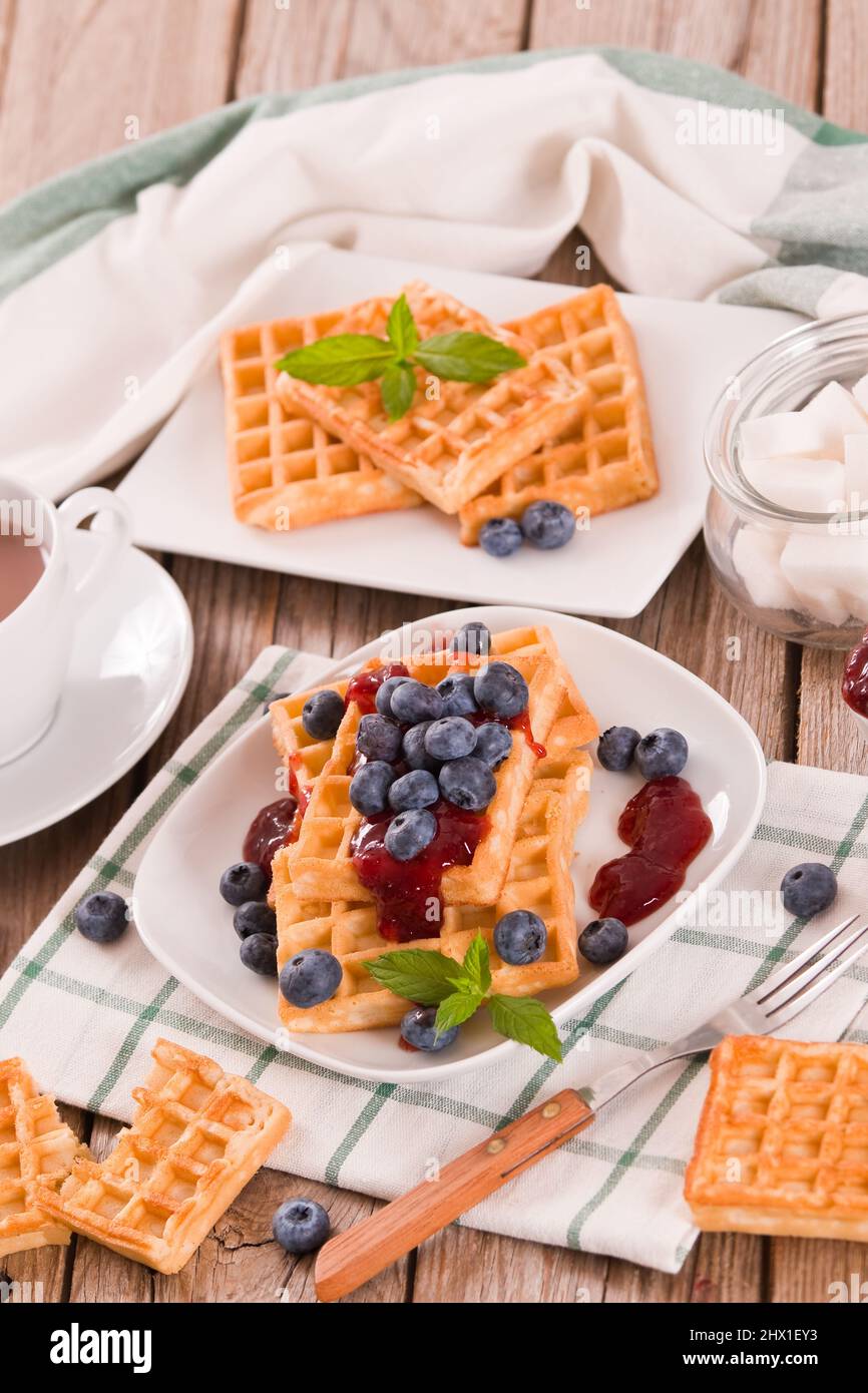 Waffles with blueberries and jam Stock Photo - Alamy