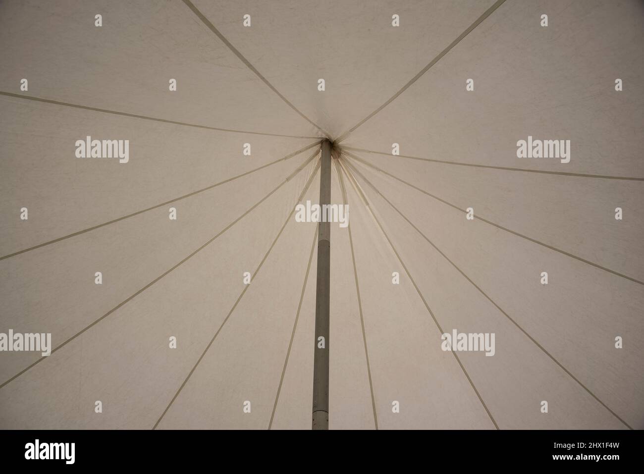 a metal post in the interior of a large white party tent Stock Photo ...