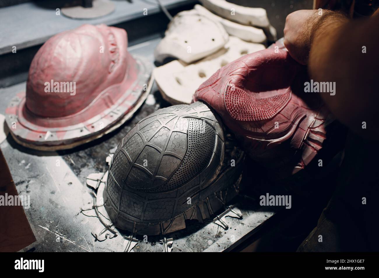 Artisan craftsman create mask based on plaster cast. Gypsum mold and ...