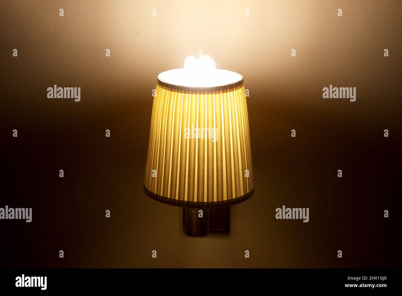 Wall mount lighting fixture ribbon truncated cone shape lit bulb ...