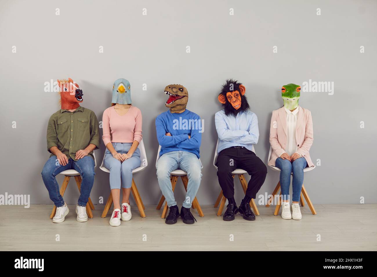 Group of adult people wearing funny animal masks waiting for job ...