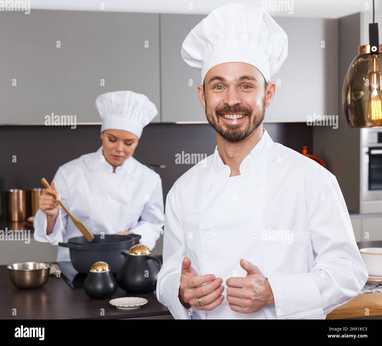 Male chef with female colleague Stock Photo - Alamy