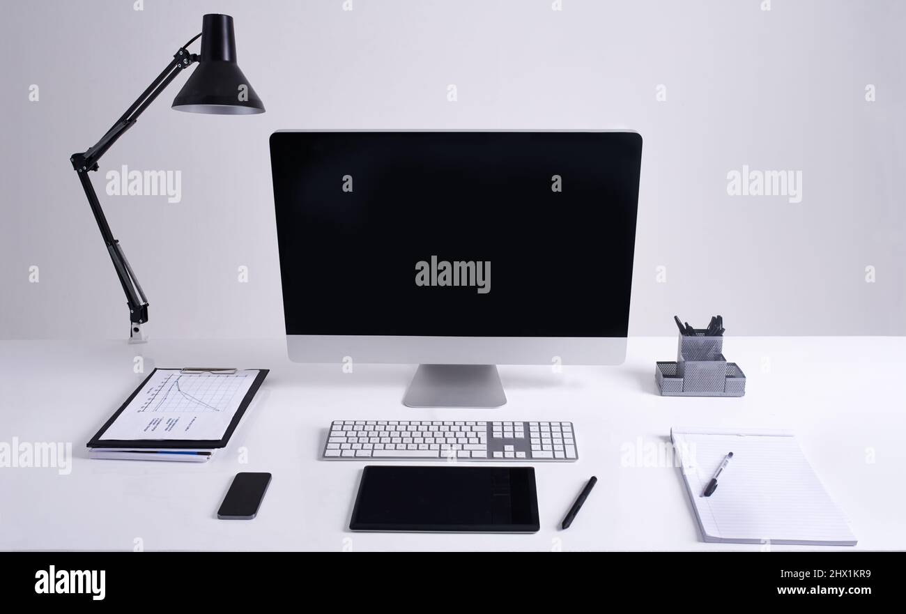 An organised space. Studio shot of an organized office workstation ...