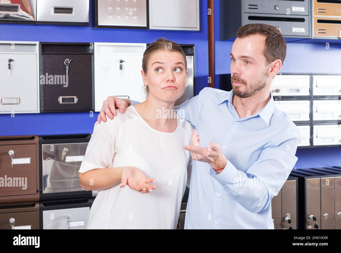 Girl with boyfriend looking for mailbox Stock Photo - Alamy