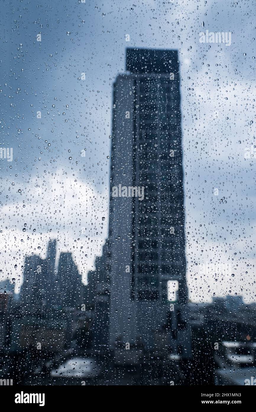 Abstract image of Rain drops on the dirty glass windows with modern ...