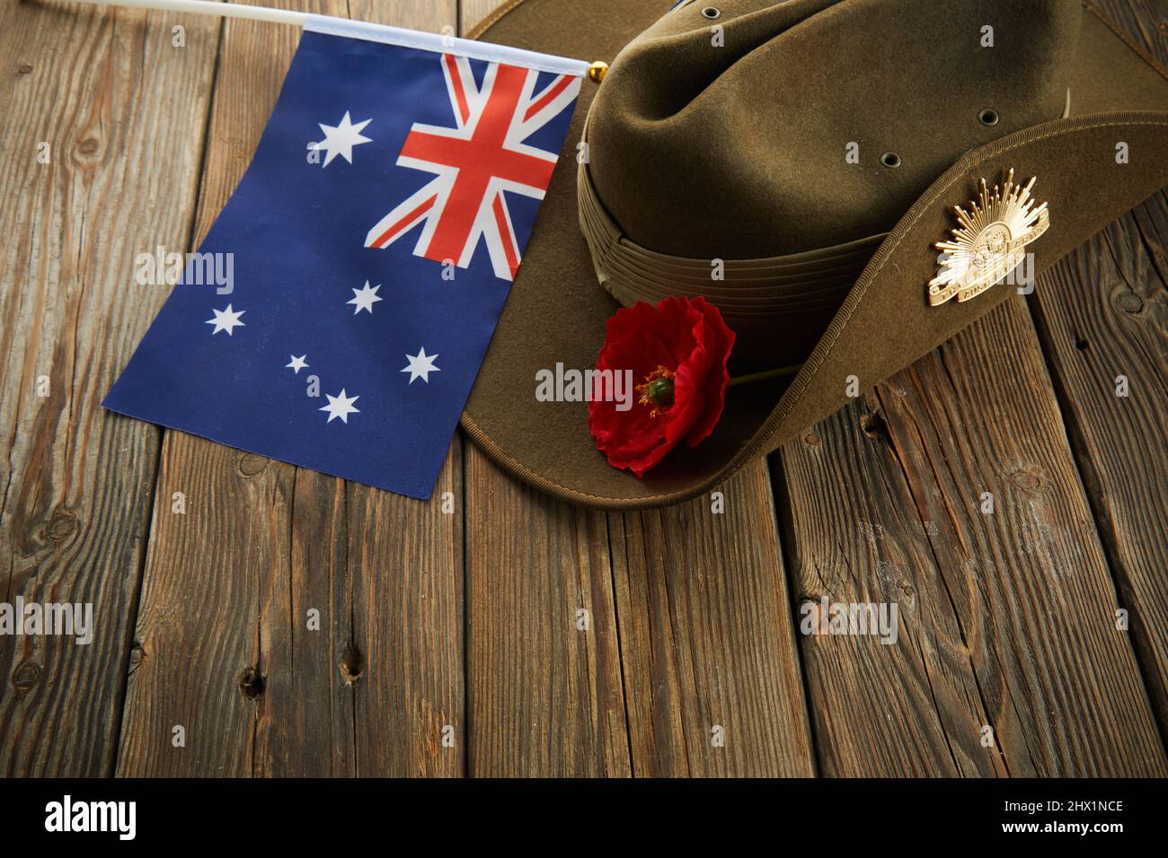 Anzac army slouch hat with Australian Flag and Poppy on wooden ...