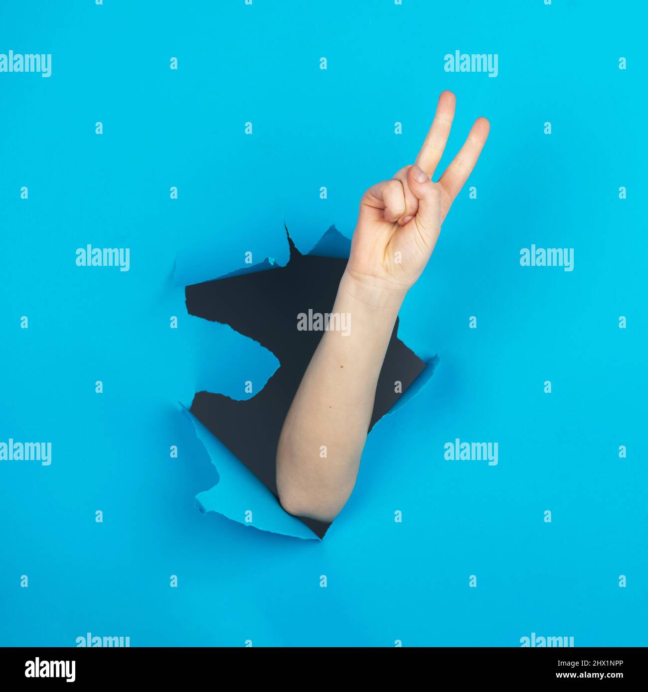 Abstract woman hand gesture of victory or v sign finger combination in ...