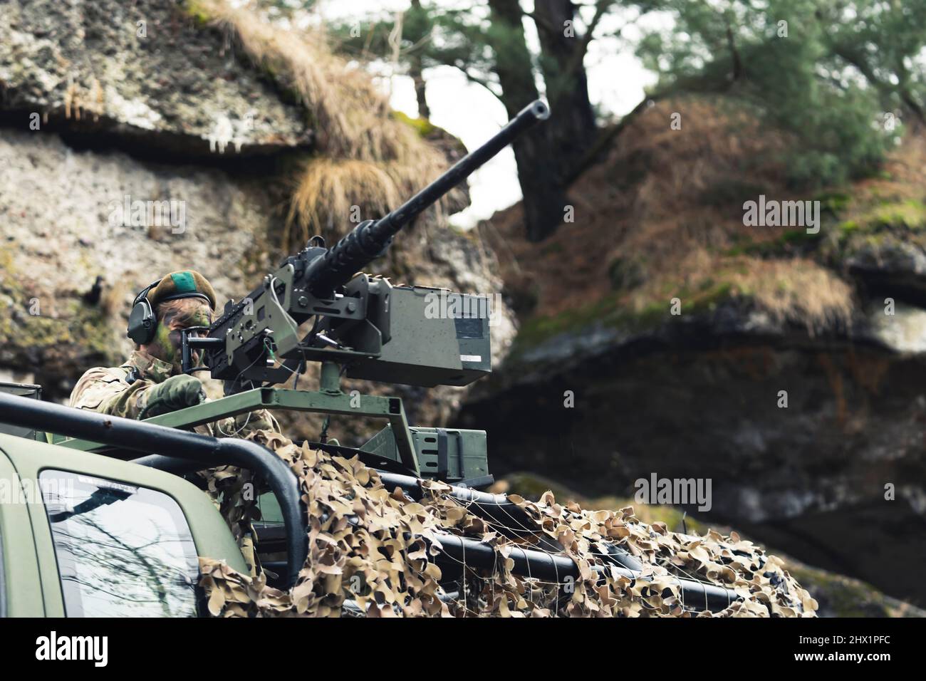 Rugged military grade machine gun mounted on truck unit . High quality ...