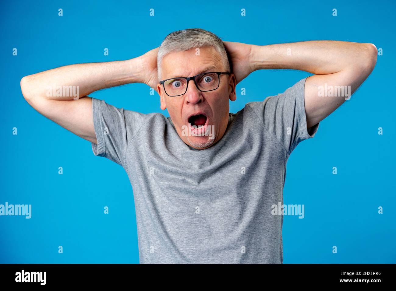 Scared middle age man nervous expressing anxiety and panic gesture ...