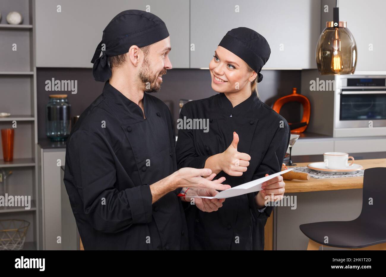 Chefs discussing menu Stock Photo - Alamy