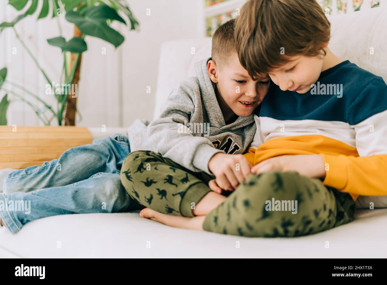 Cheerful two Childs boys playing online game, watching video on ...