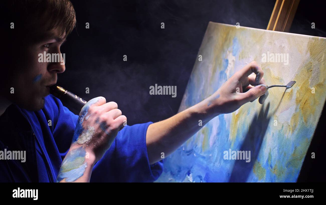 Artist copyist paint seascape with ship in ocean. Vaper smoke vape e ...