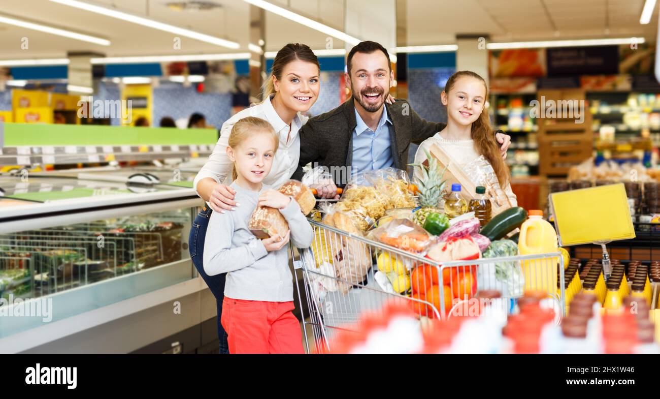 Family with purchases in supermarket Stock Photo - Alamy