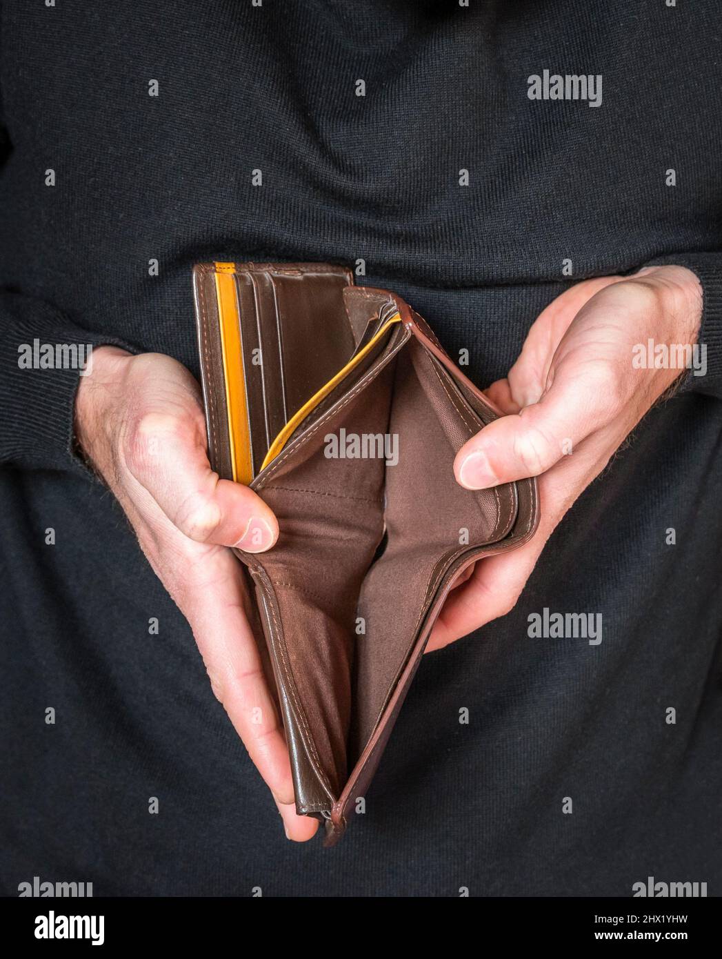 Hands holding an empty wallet Stock Photo - Alamy
