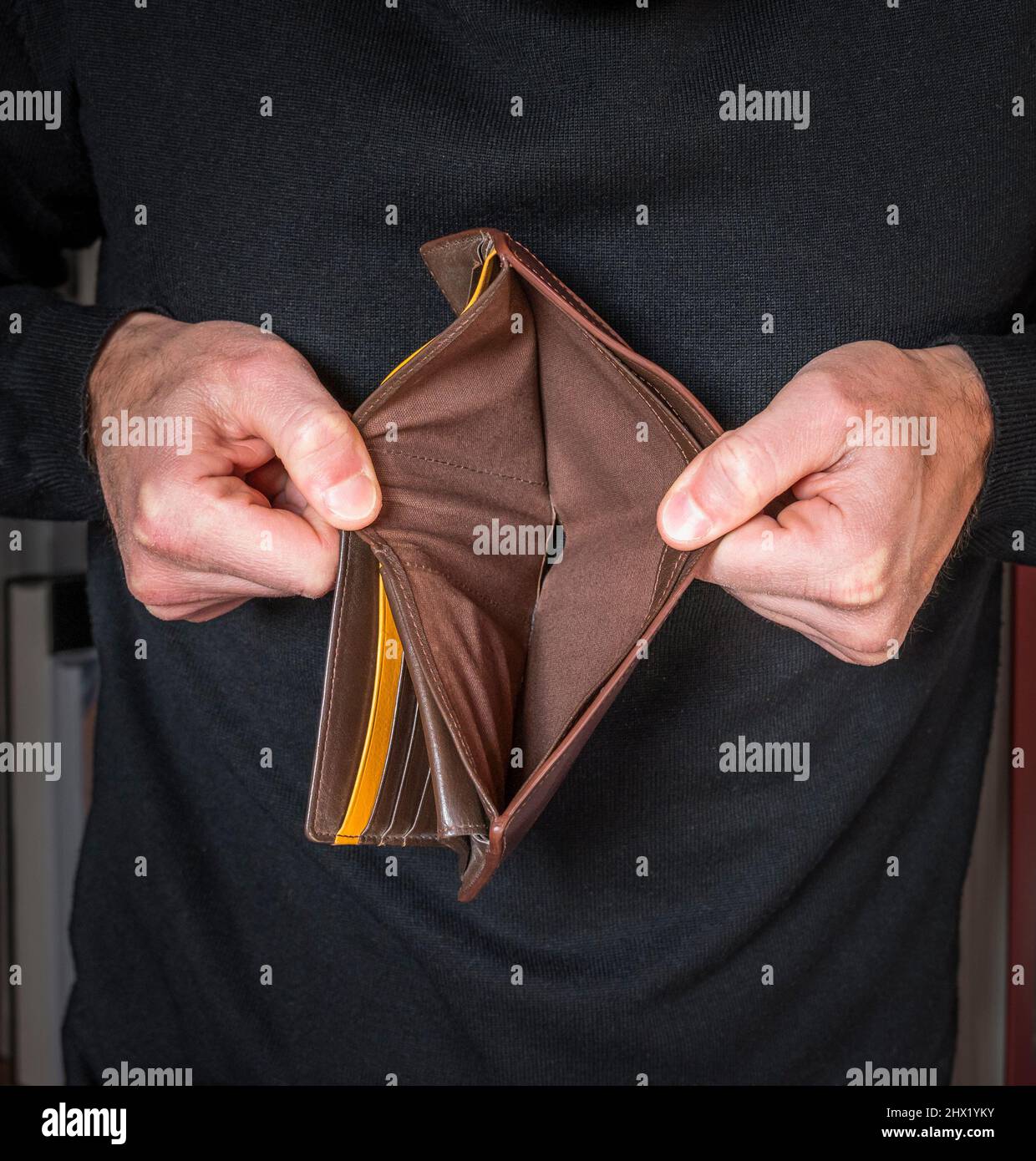 Hands holding an empty wallet Stock Photo - Alamy