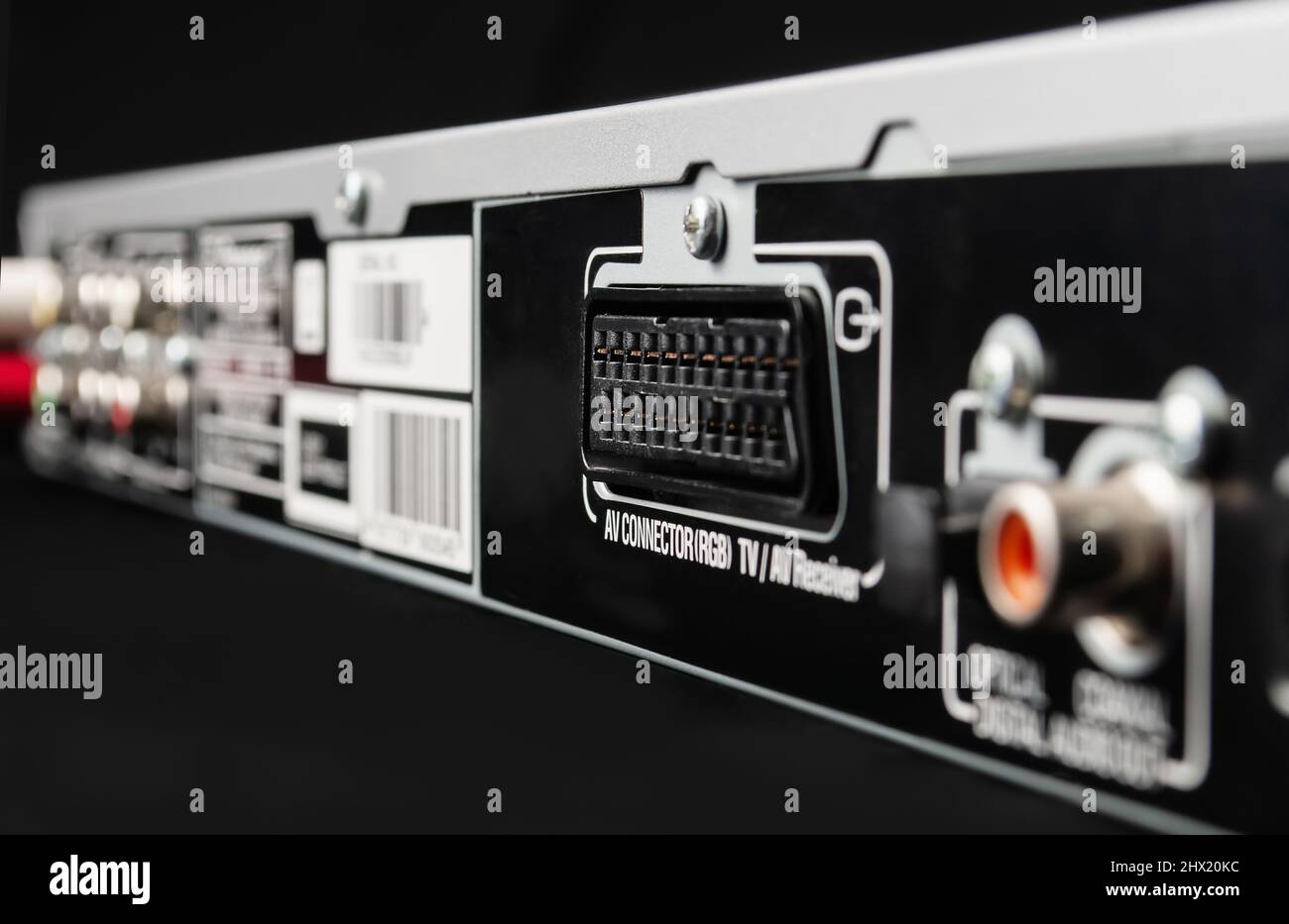 modern multimedia and audio equipment with attached cables on black ...