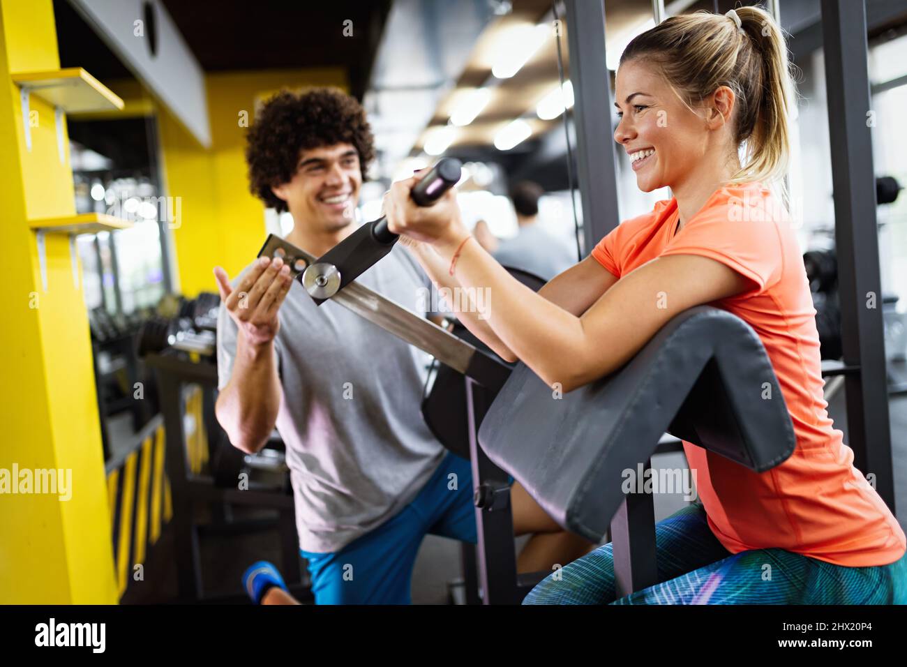 Portrait of happy fit people, friends exercising in gym together. Sport ...