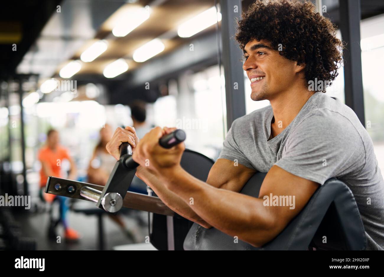 Portrait of fit man working out in gym. Sport people healthy lifestyle ...