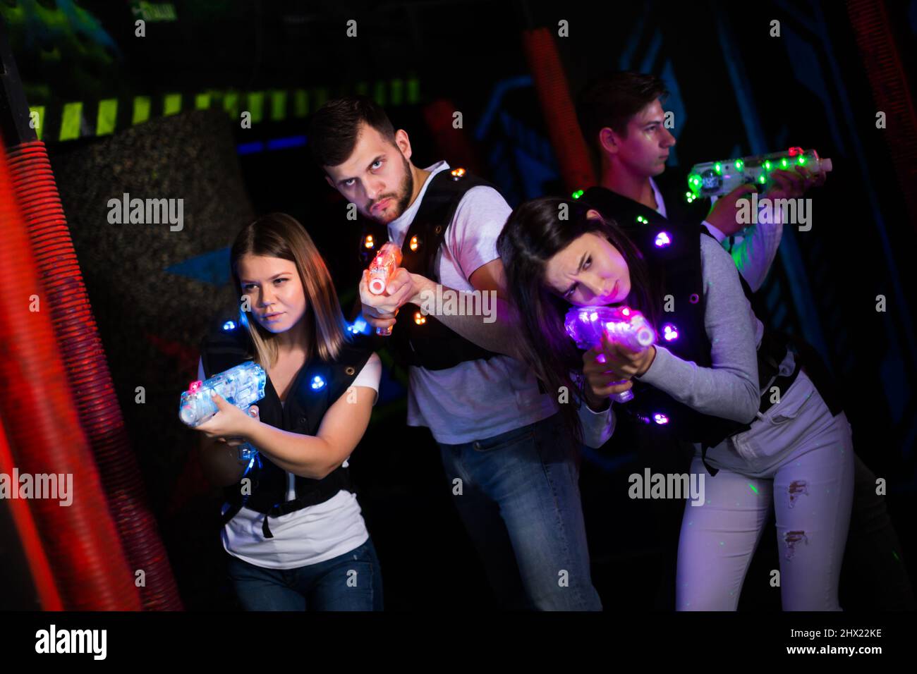 Young people playing laser tag Stock Photo - Alamy