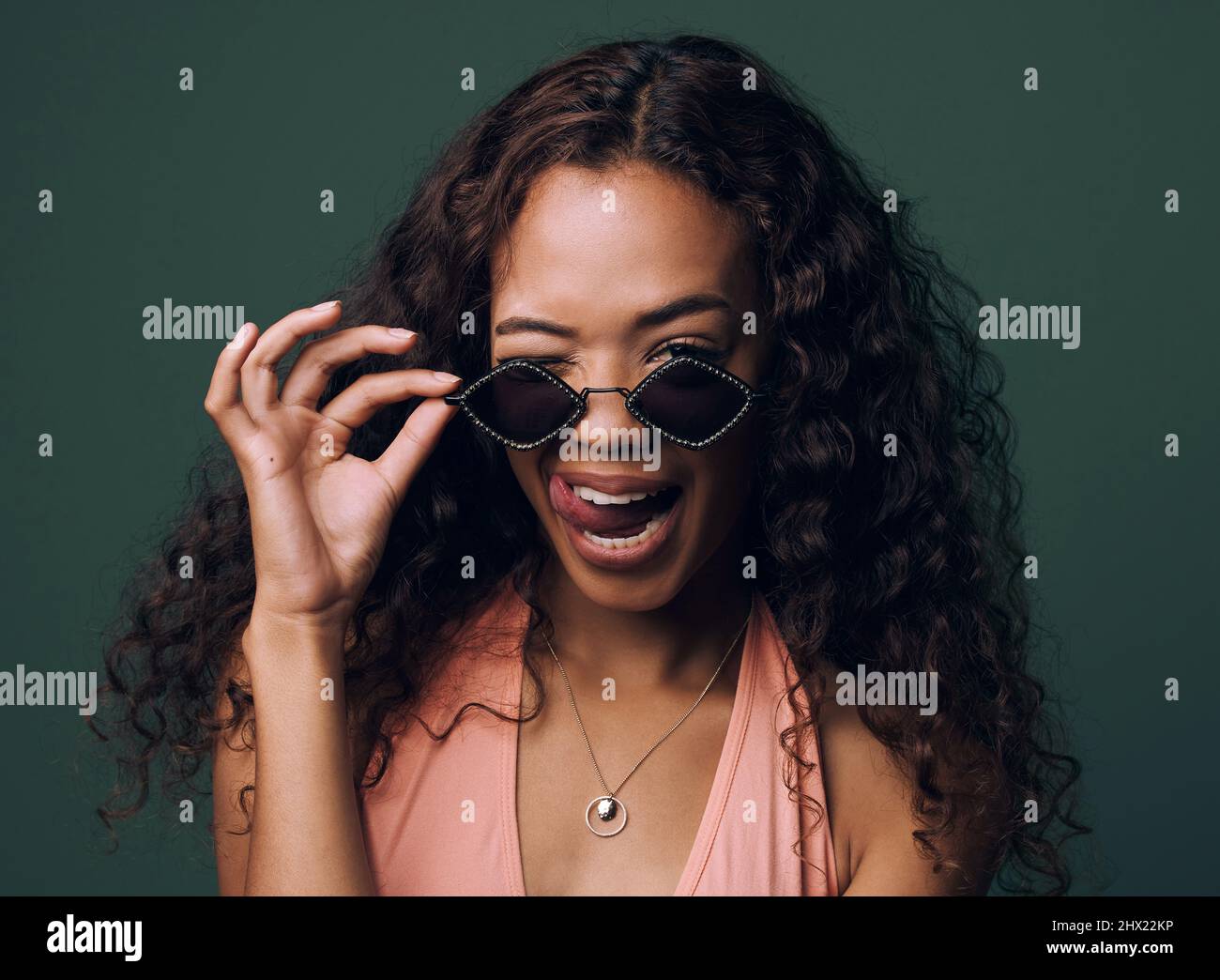 Stylishly silly. Cropped portrait of an attractive and quirky young ...