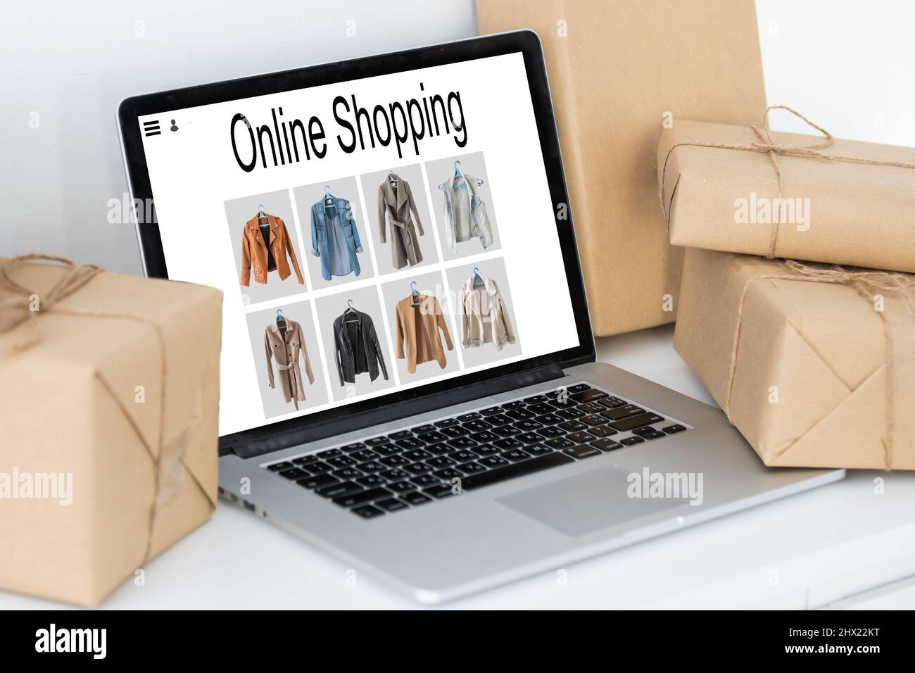 shopping, technology and internet concept: shopping with laptop ...
