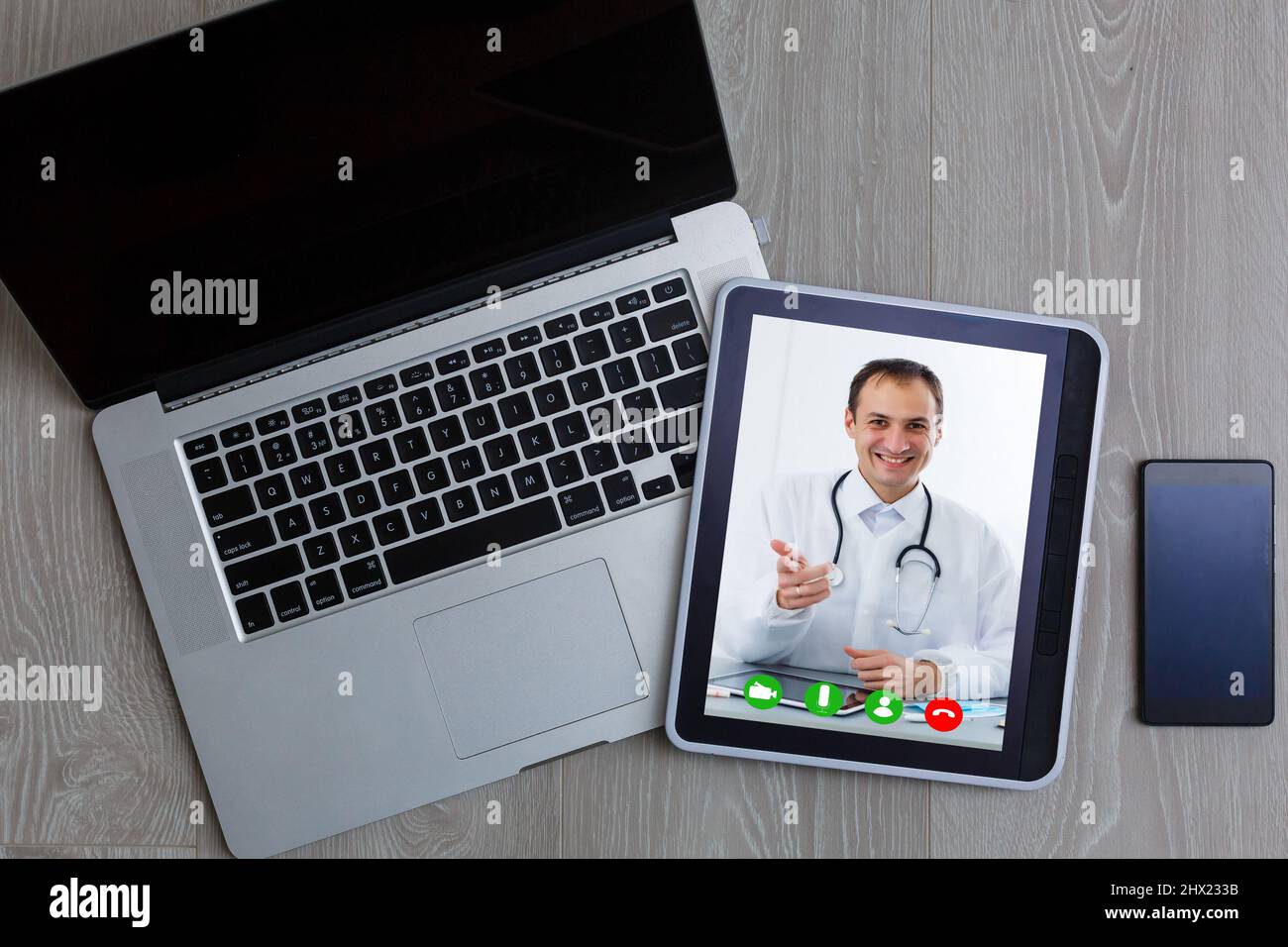 Doctor video chatting with a patient Stock Photo - Alamy