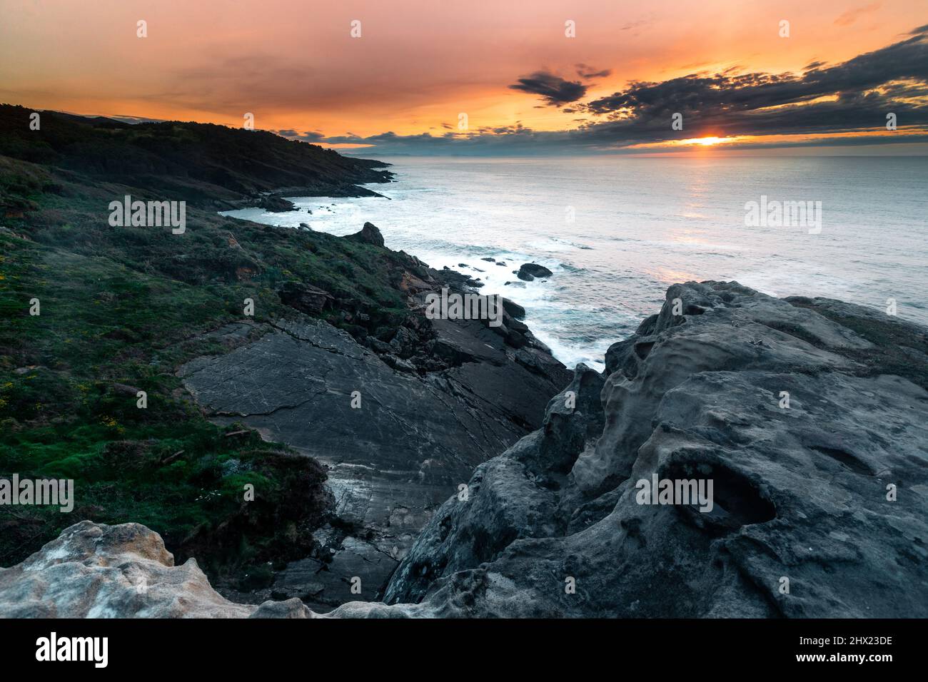 Sunset in the basque coast under Jaizkibel mountain in Hondarribia ...