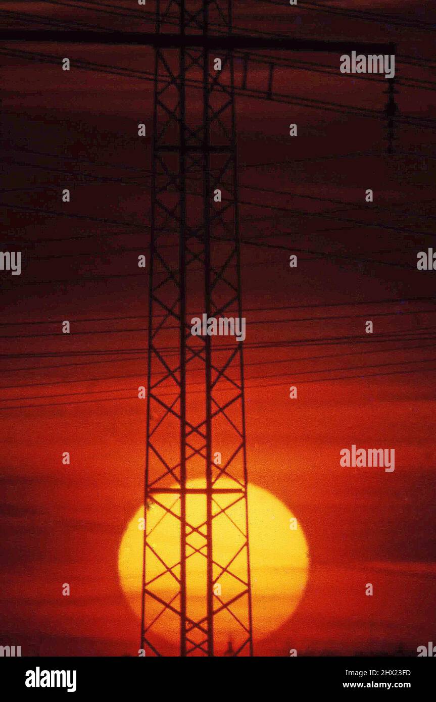 Setting Sun Behind Power Pole Stock Photo - Alamy