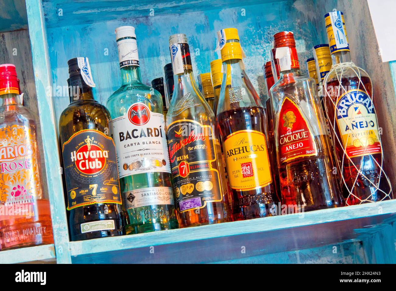 Coloured Ron Liqueur Bottles at Bar Stock Photo - Alamy