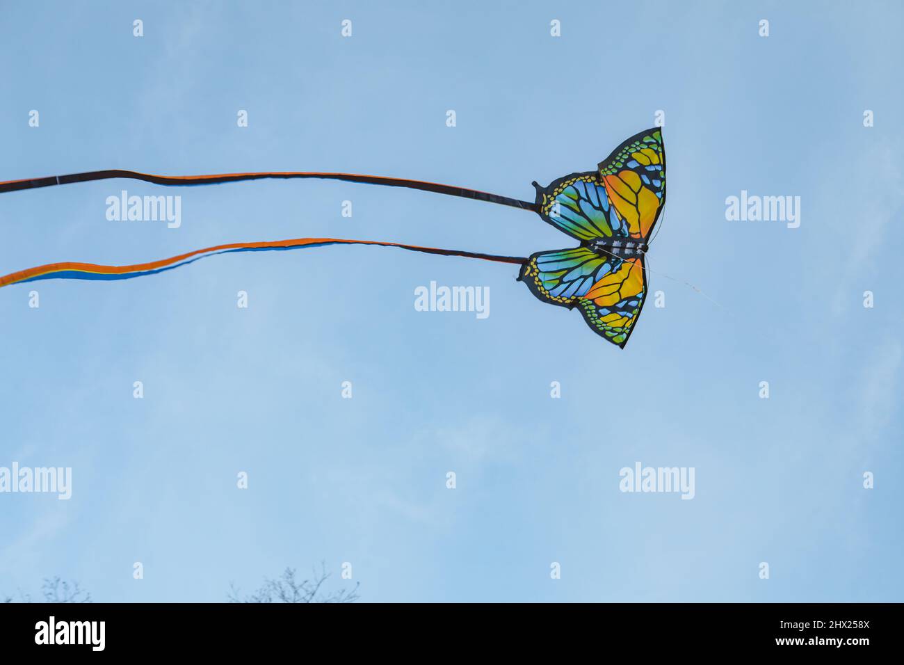 butterfly kite in sky copy space Stock Photo - Alamy