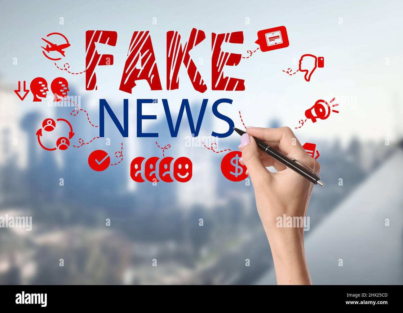 Hand of woman with pen writing text FAKE NEWS on glass Stock Photo - Alamy