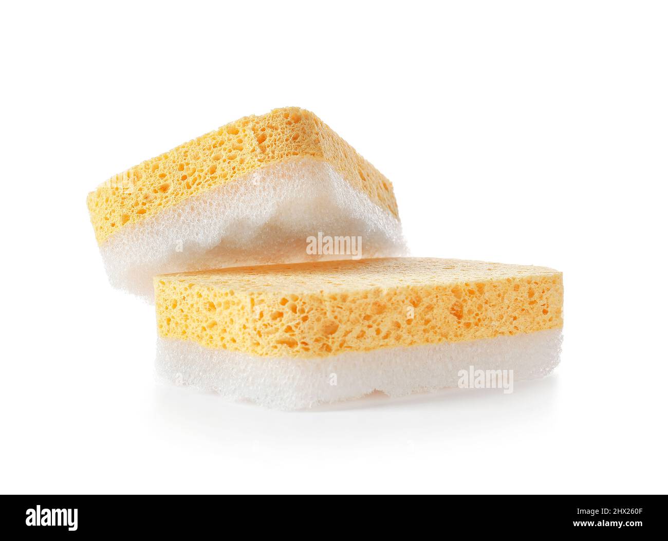 Yellow bath sponges on white background Stock Photo - Alamy