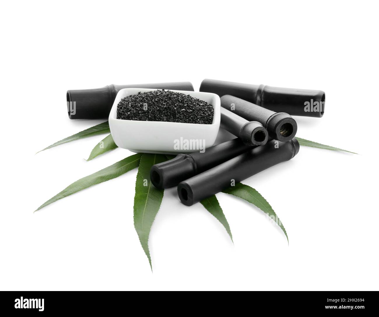 Composition with bowl of activated carbon powder and black bamboo ...