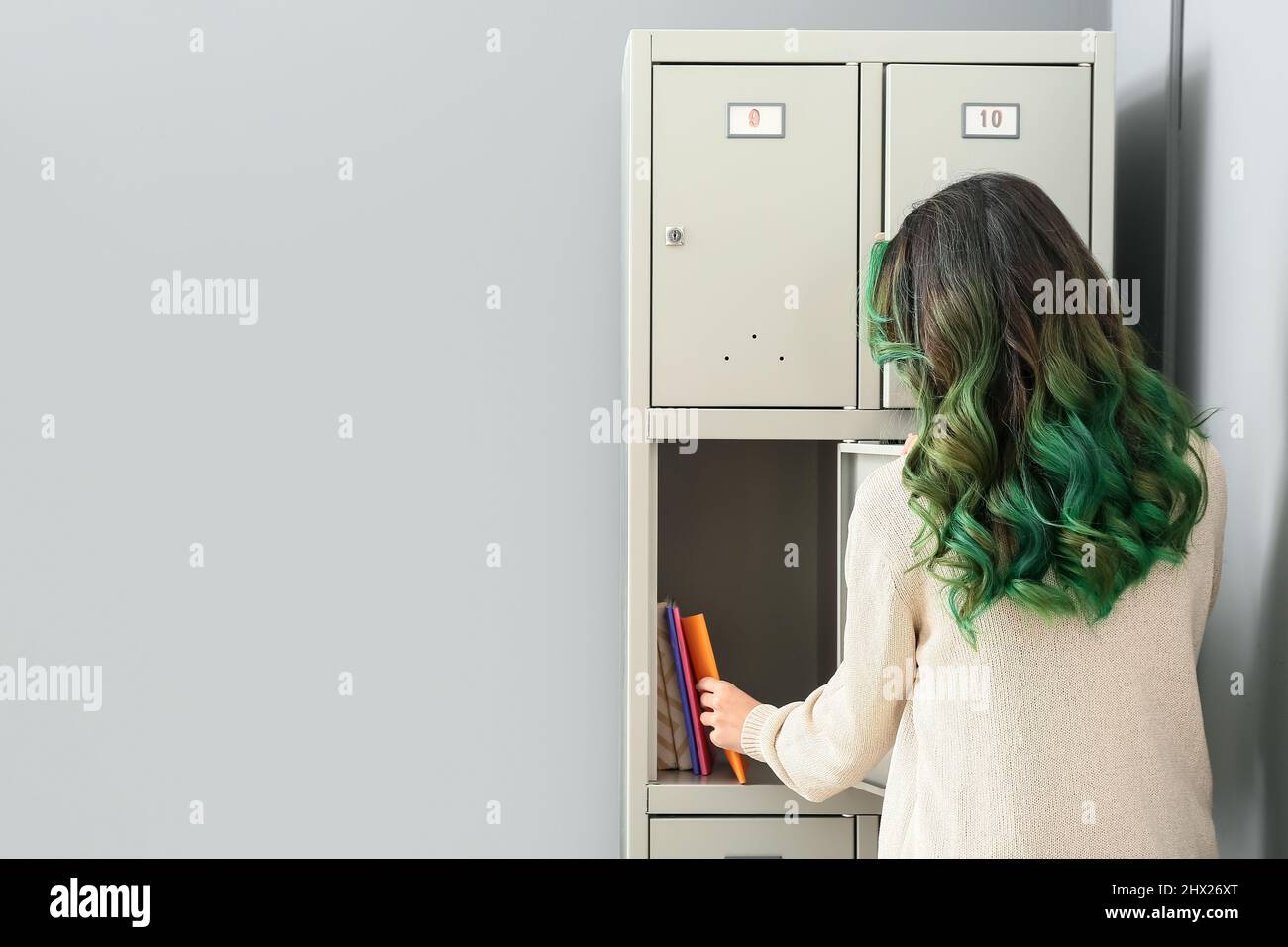 Girl near school locker hi-res stock photography and images - Alamy