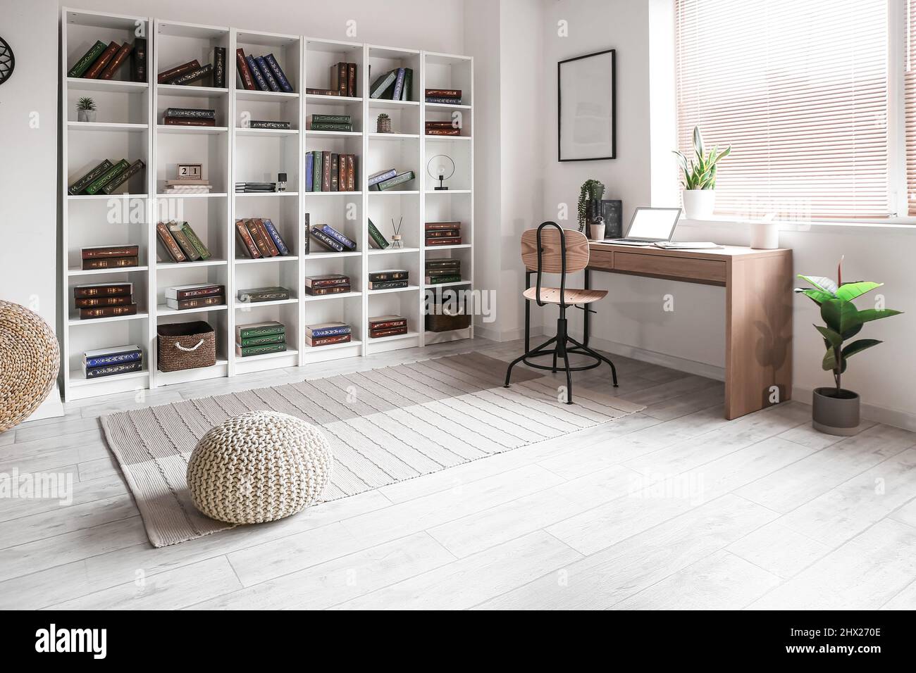 Interior of modern home library with workplace Stock Photo - Alamy