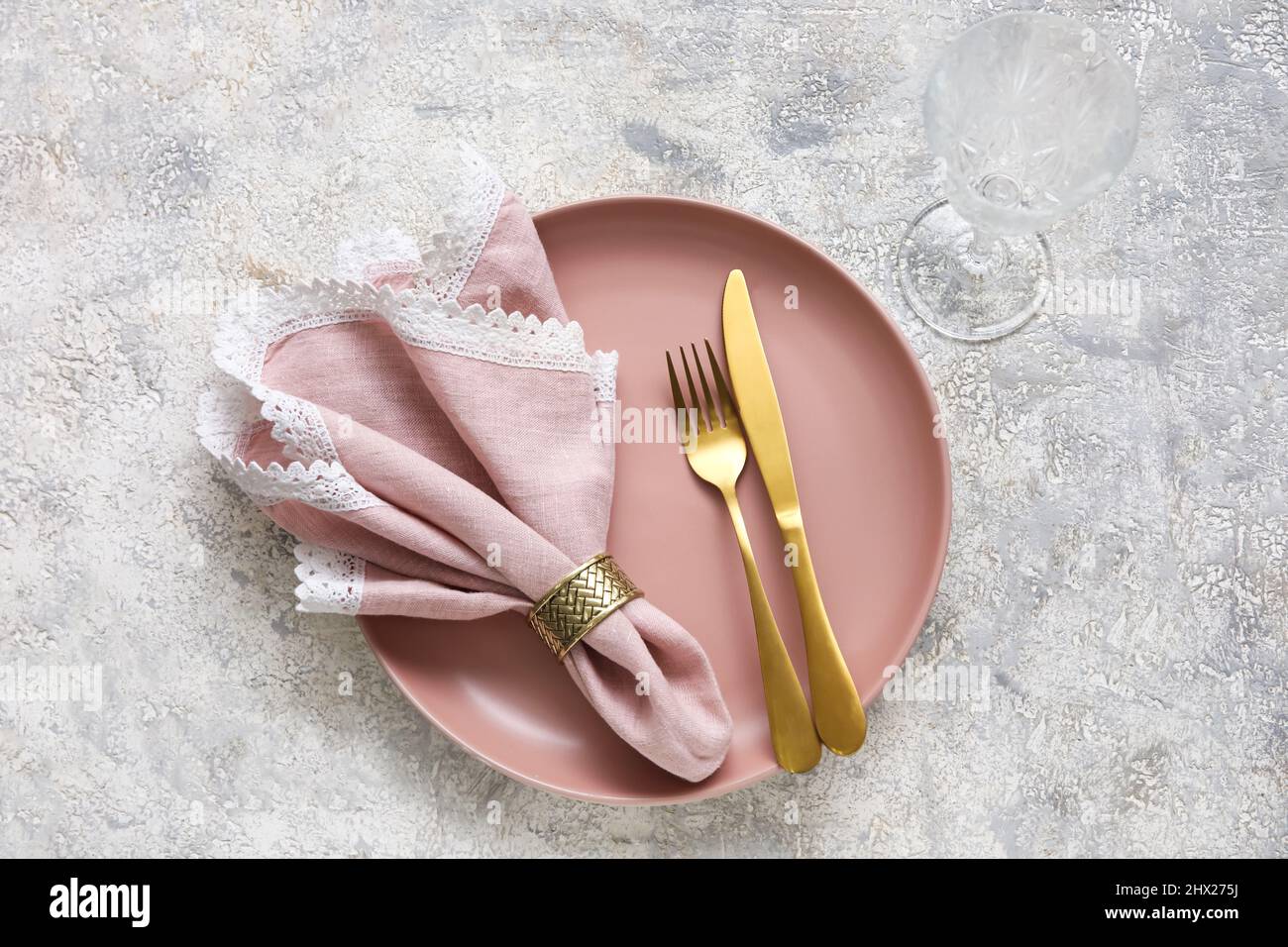 Simple beautiful table setting on light background Stock Photo - Alamy