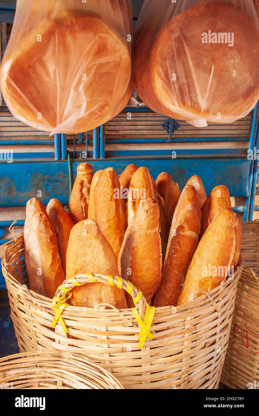 Baguette or French bread in the wicker baskets selling at a local ...