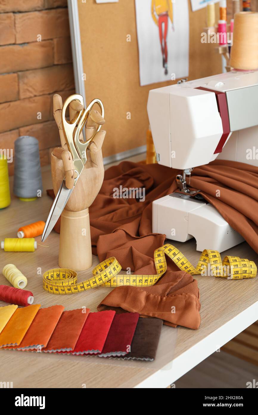 Tailor's workplace in modern atelier Stock Photo - Alamy