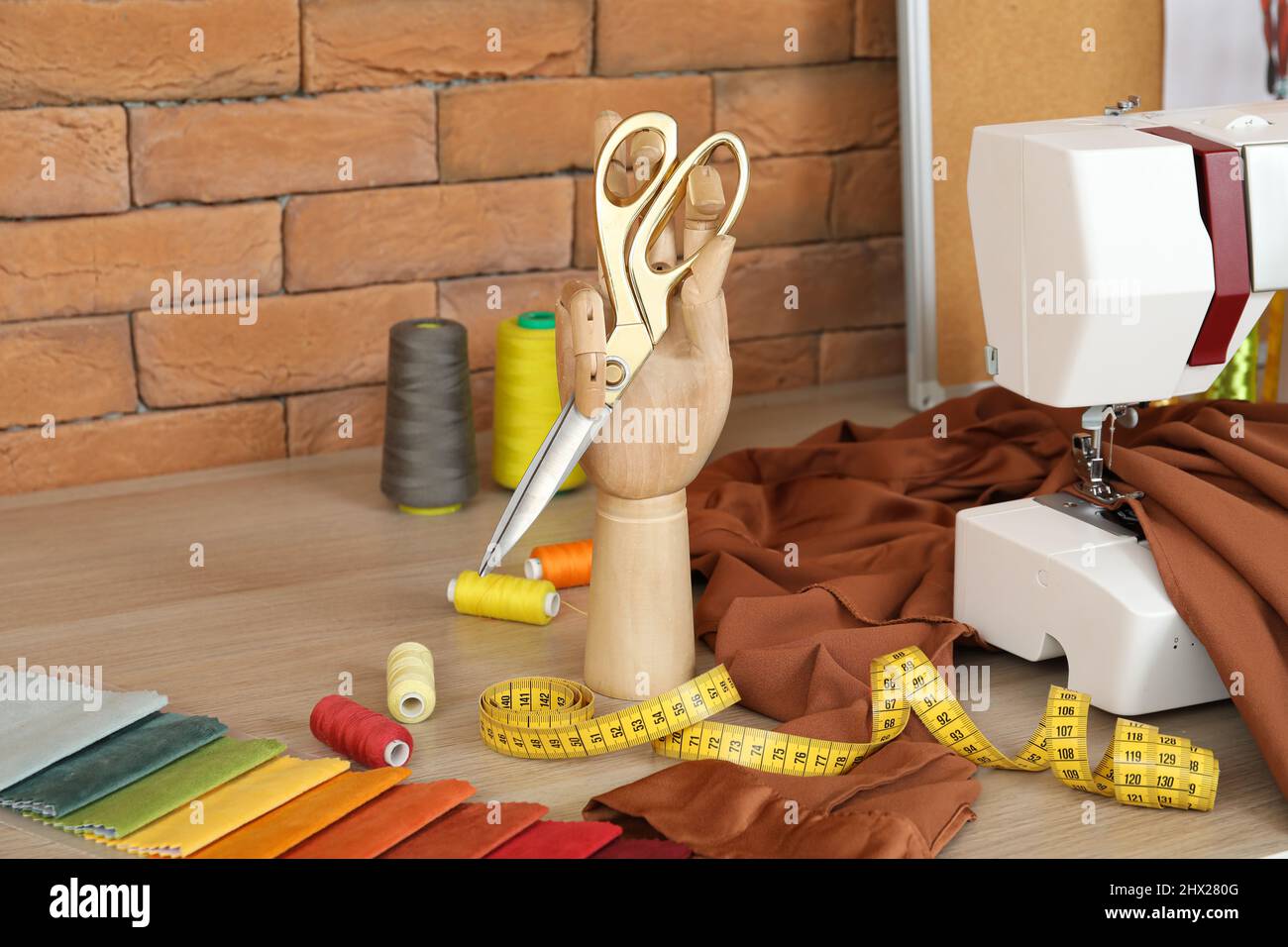 Tailor's workplace in modern atelier Stock Photo - Alamy