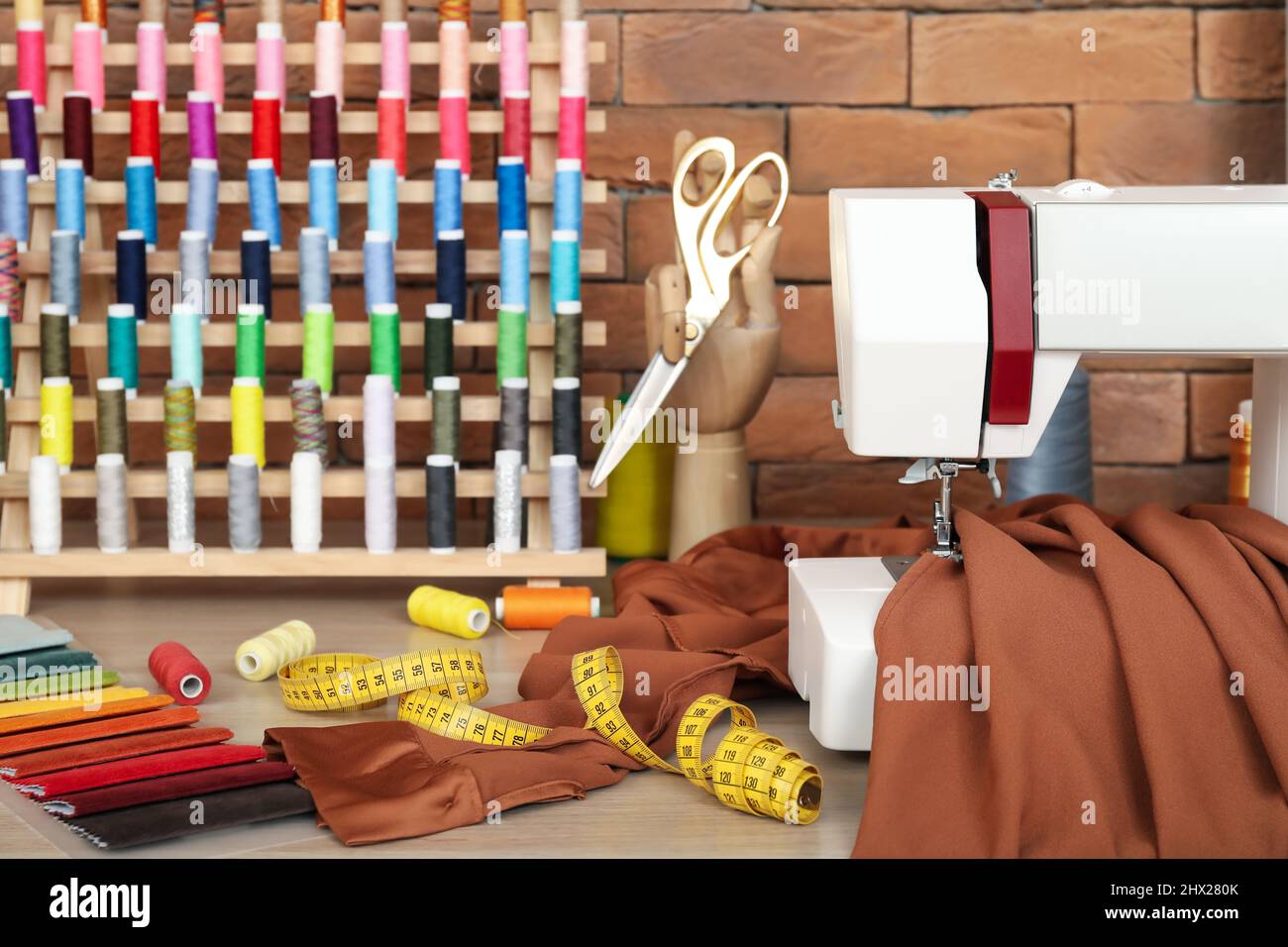 Tailor's workplace in modern atelier Stock Photo - Alamy