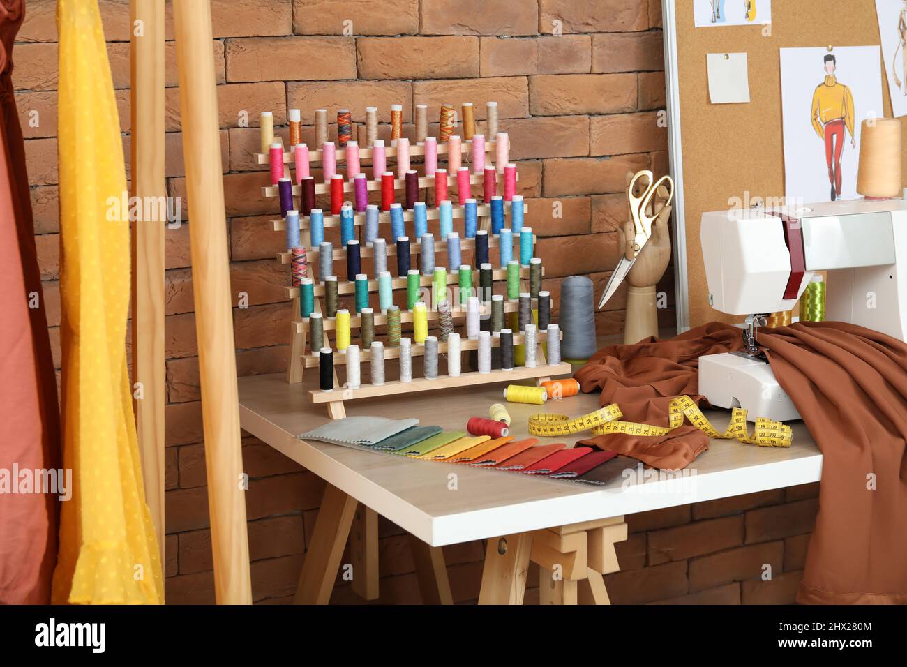 Tailor's workplace in modern atelier Stock Photo - Alamy