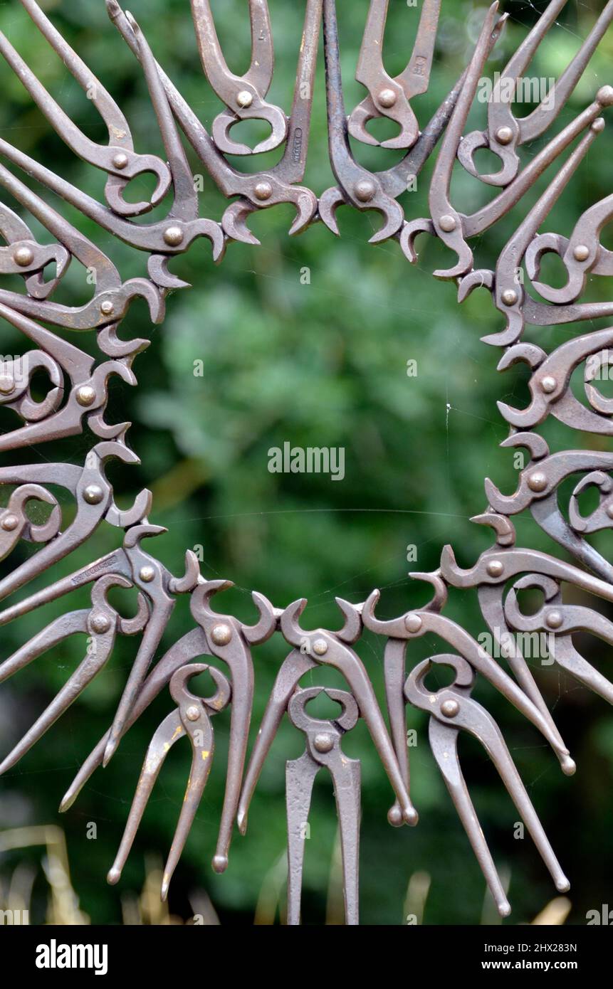 welded sculpture made from assembled redundant nail pincers Stock Photo ...