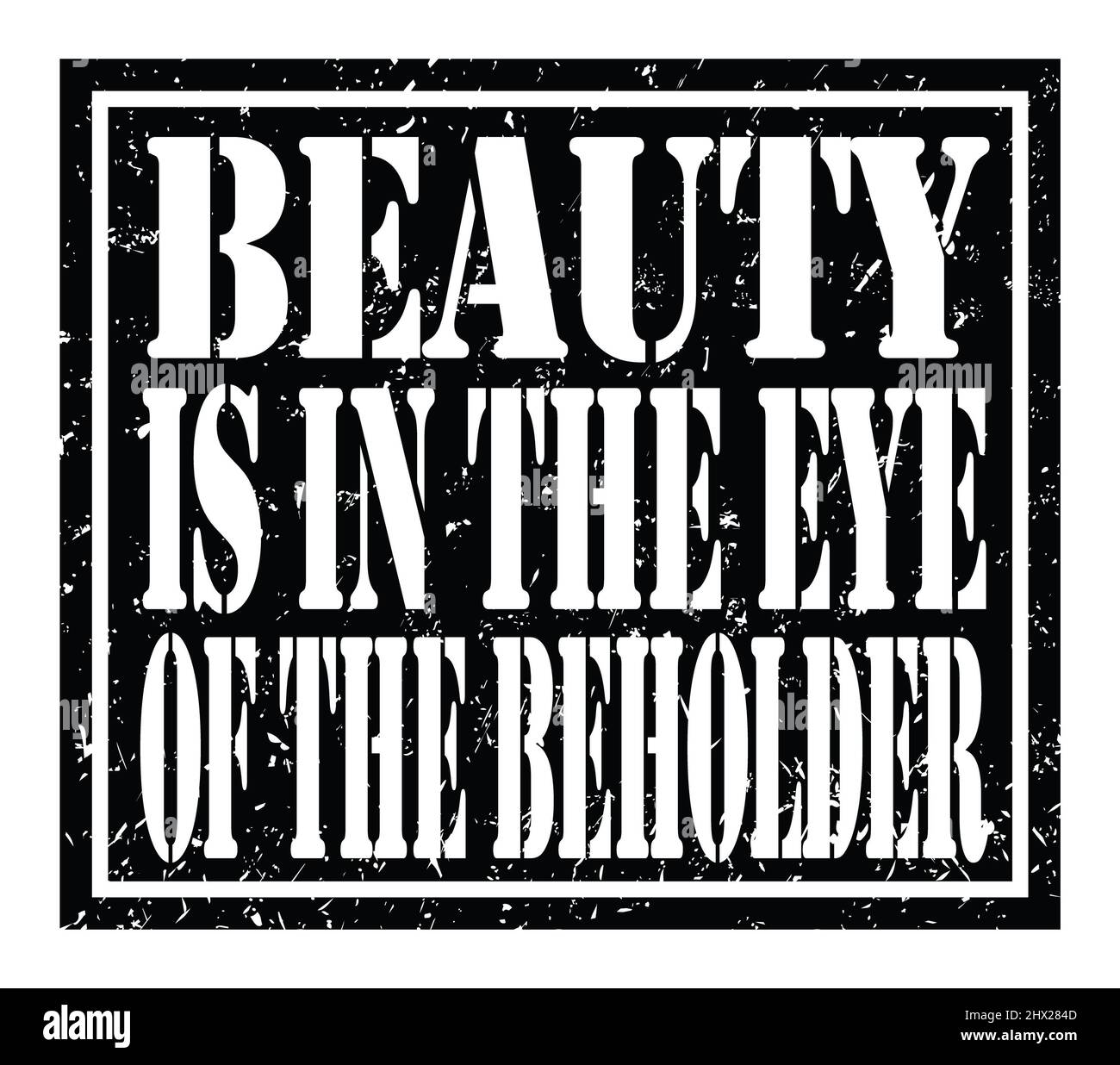 BEAUTY IS IN THE EYE OF THE BEHOLDER, words written on black stamp sign ...