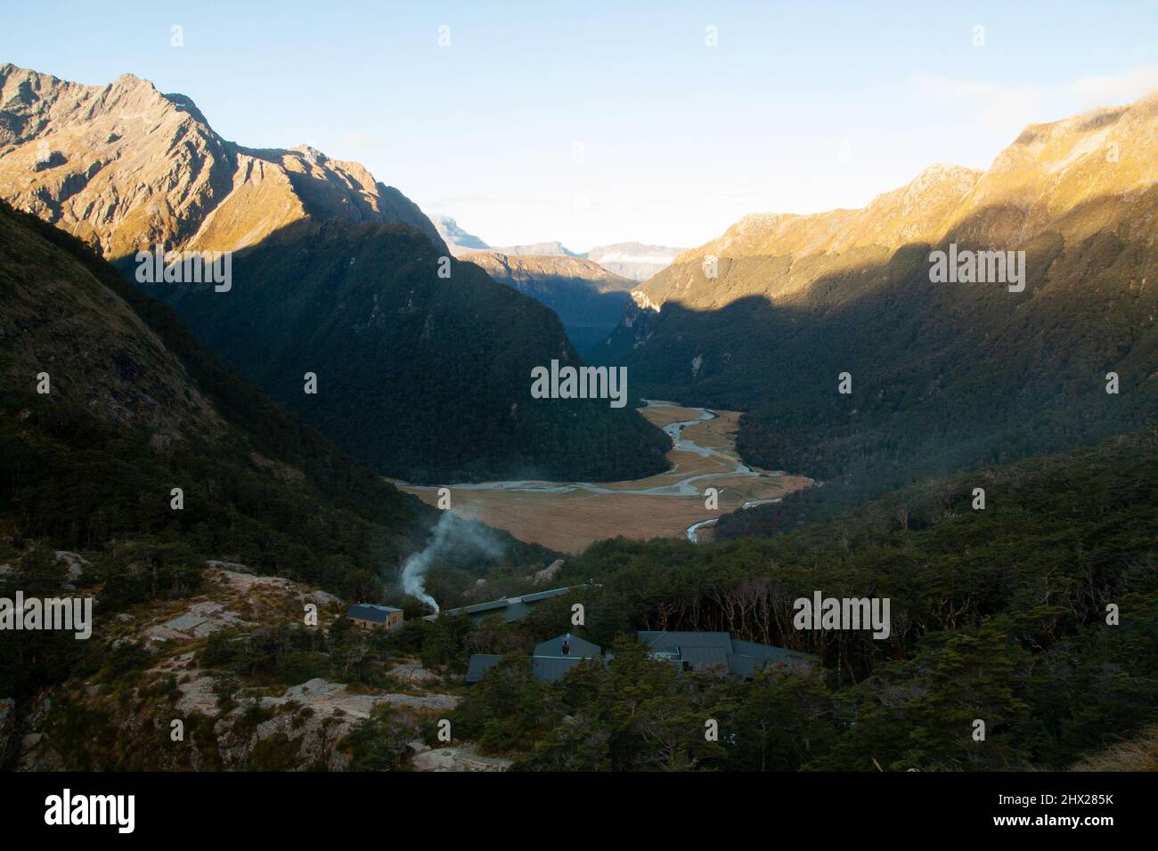 Routeburn Flats Hut and mountain valley at Routeburn Track, New Zealand ...