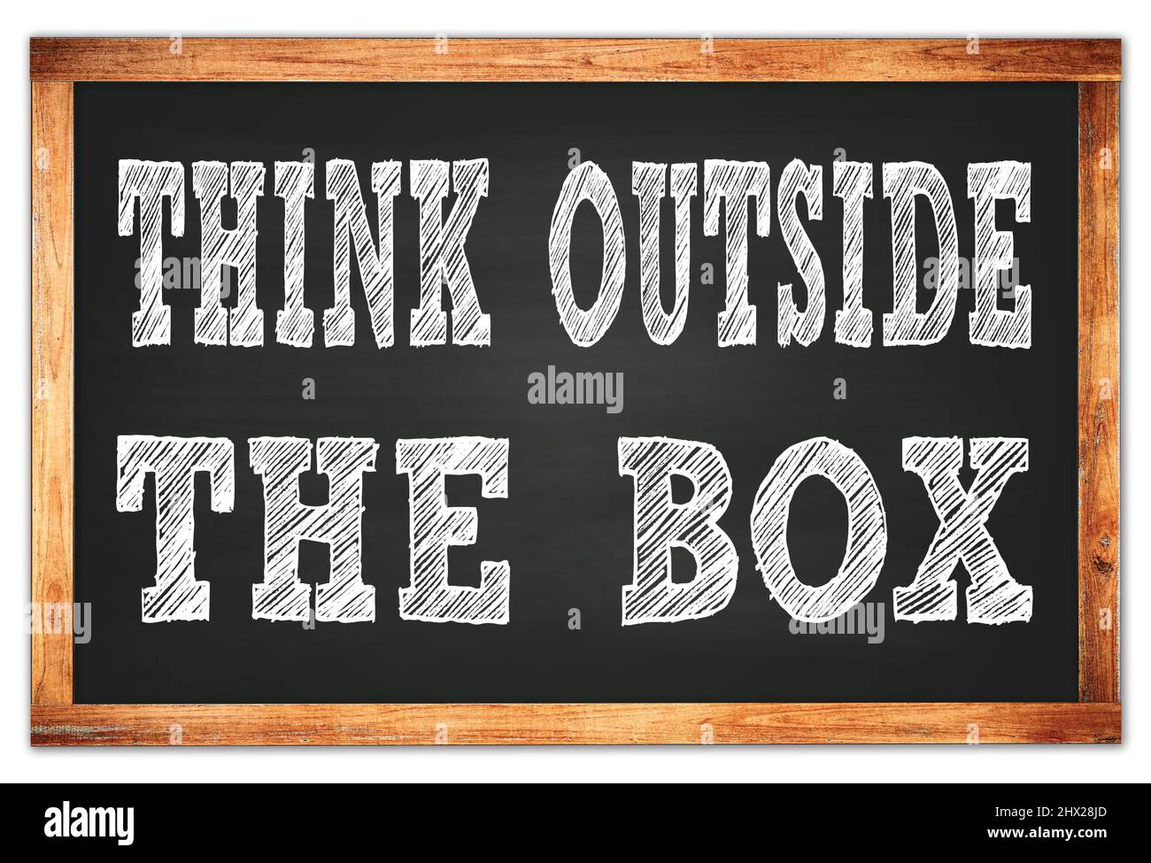 THINK OUTSIDE THE BOX written on black wooden frame school blackboard ...