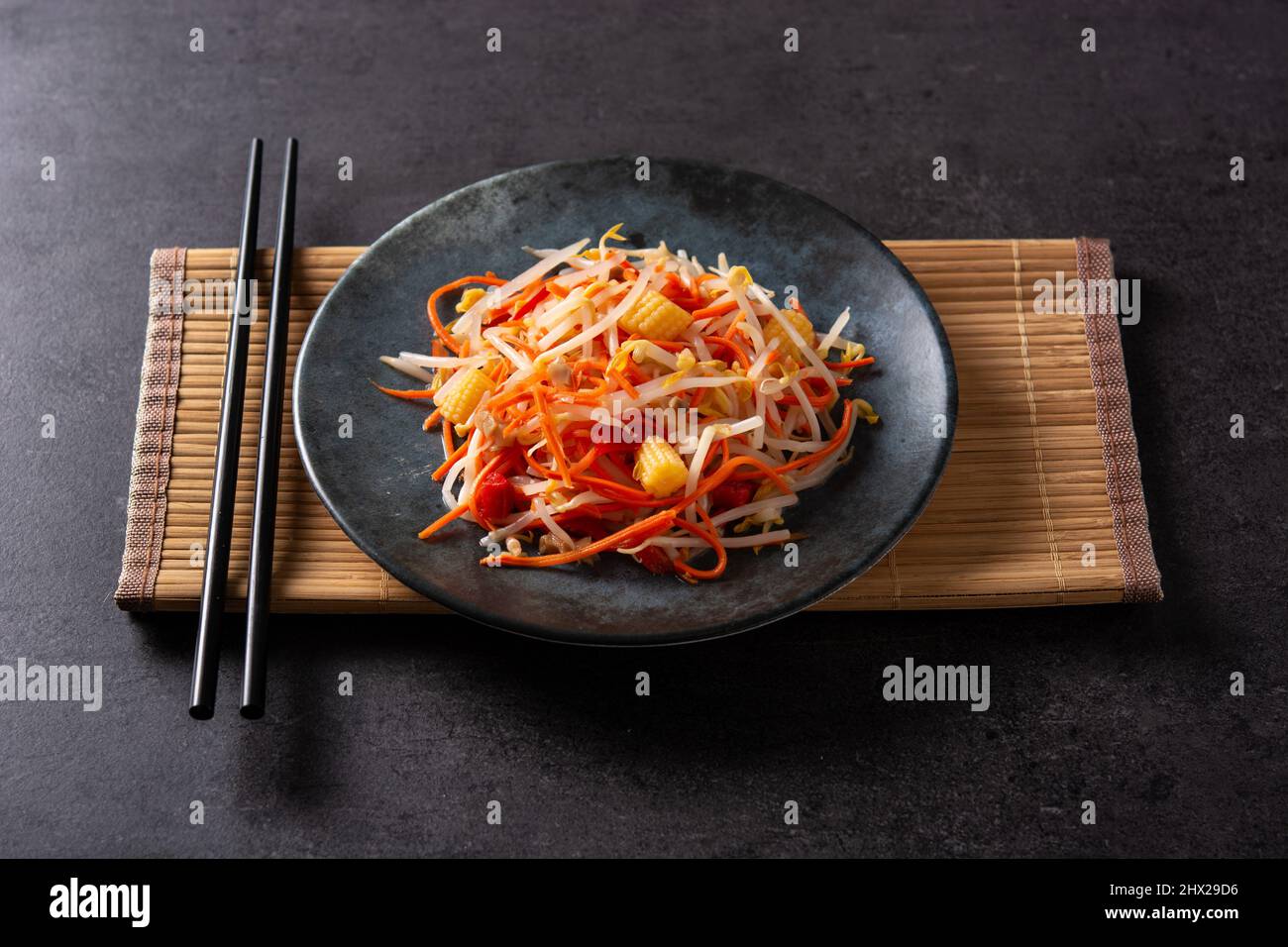 Healthy Chinese cabbage salad in plate on black background Stock Photo ...