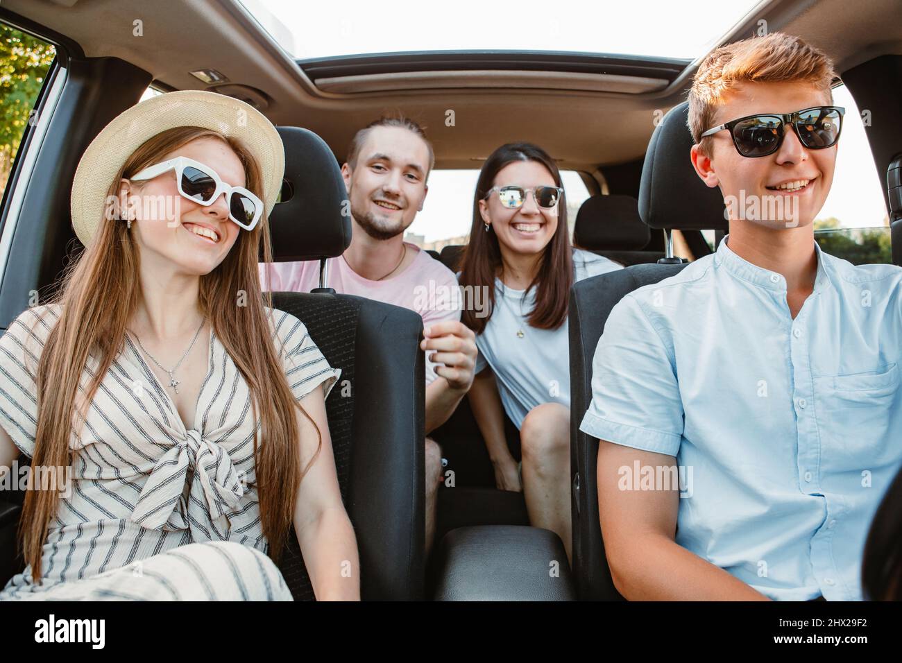 group of friends in car. road trip concept. summer vacation. friendship ...