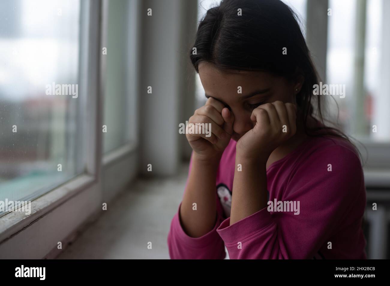 little girl praying near the window Stock Photo - Alamy