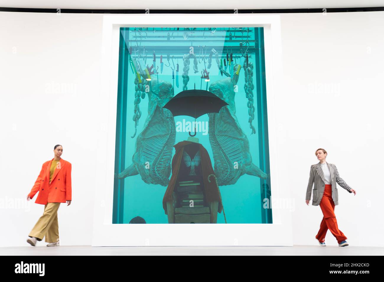 Gallery assistants walk past The Pursuit of Oblivion, 2004, during the ...