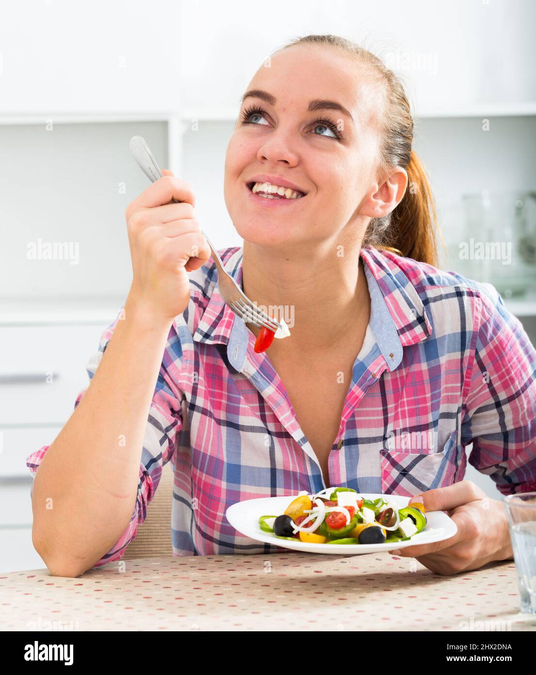 girl with chestnut hair eating salad Stock Photo - Alamy